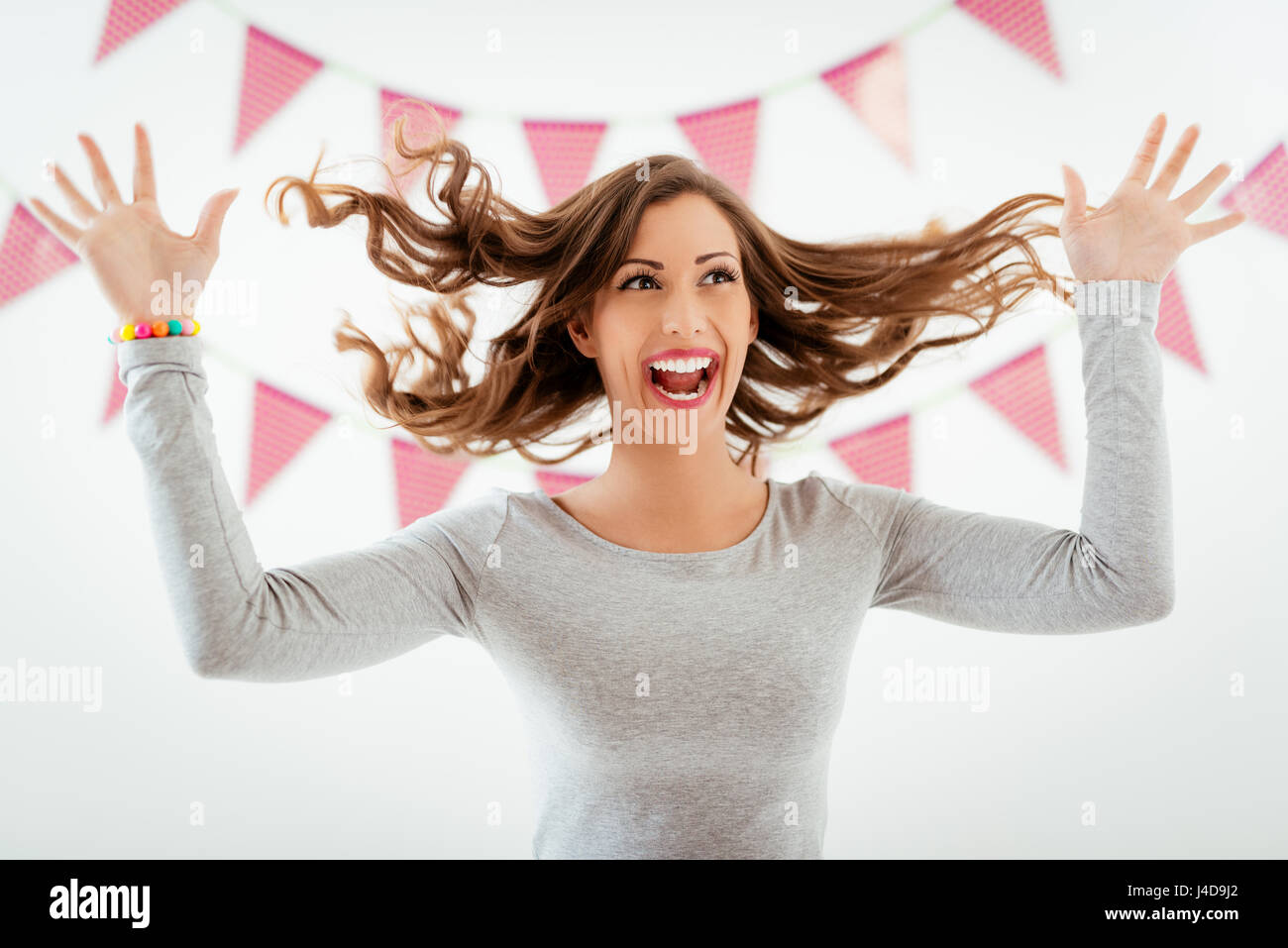 Beautiful young smiling woman having fun with flying long hair Stock ...
