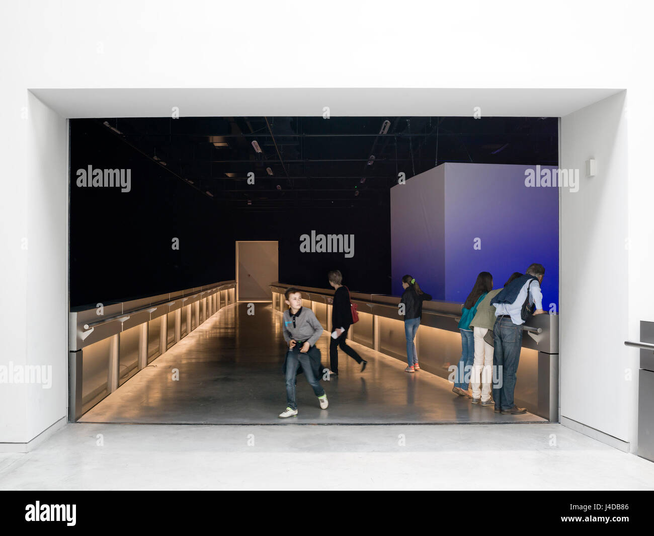 Interior bridge offering views of an exhibition space from above. Musée ...