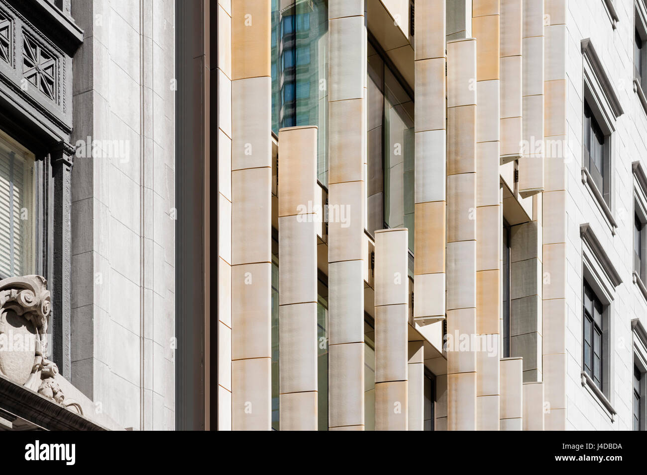 Detail of vertical terracotta fins including neighboring buildings ...