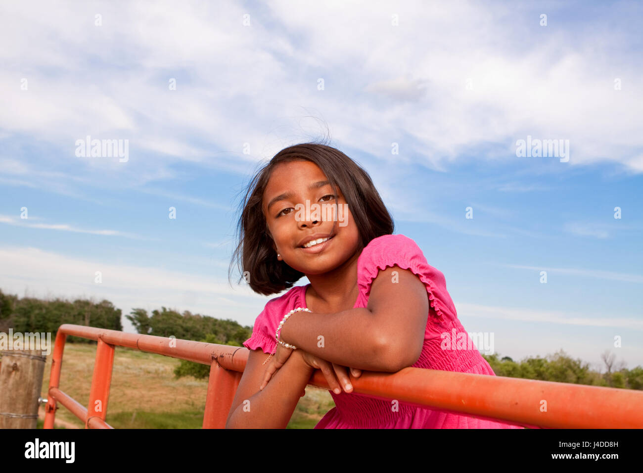 Hispanic little girl playing outside Stock Photo - Alamy