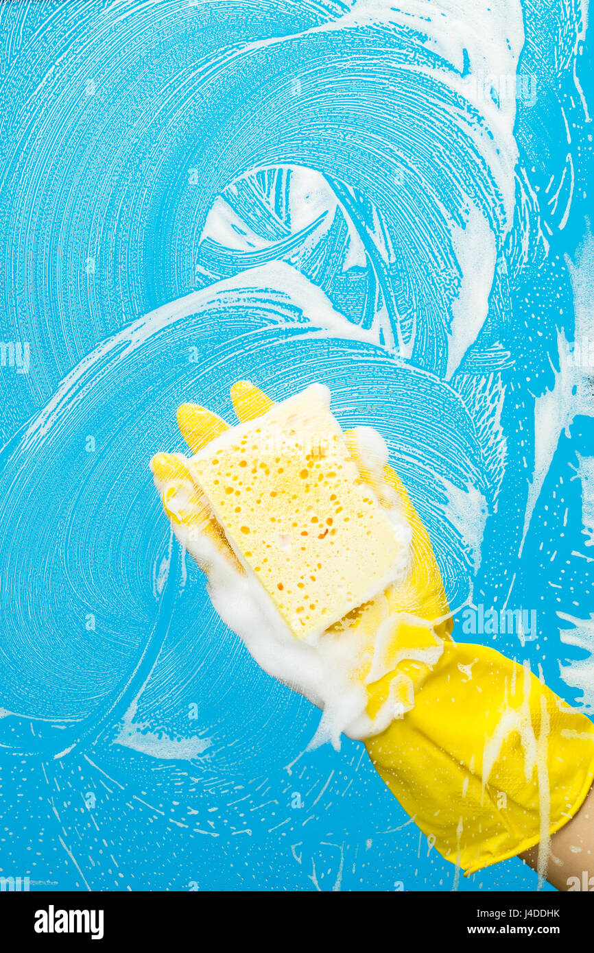 Person with sponge cleaning window Stock Photo - Alamy