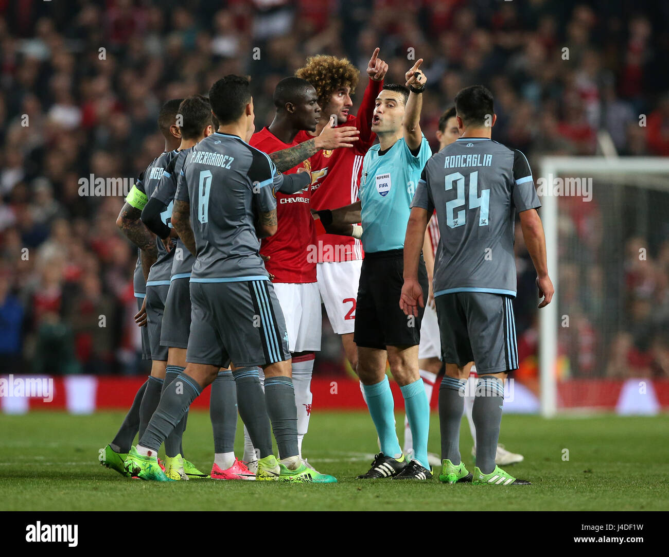 Referee Ovidiu Alin Hategan gestures after showing Manchester United's ...