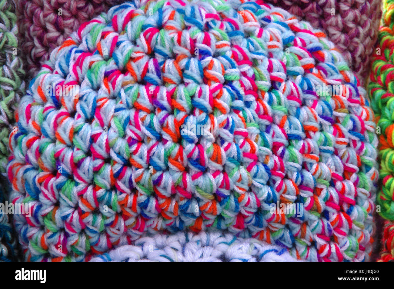 The handmade wool caps in variegated colors Stock Photo - Alamy