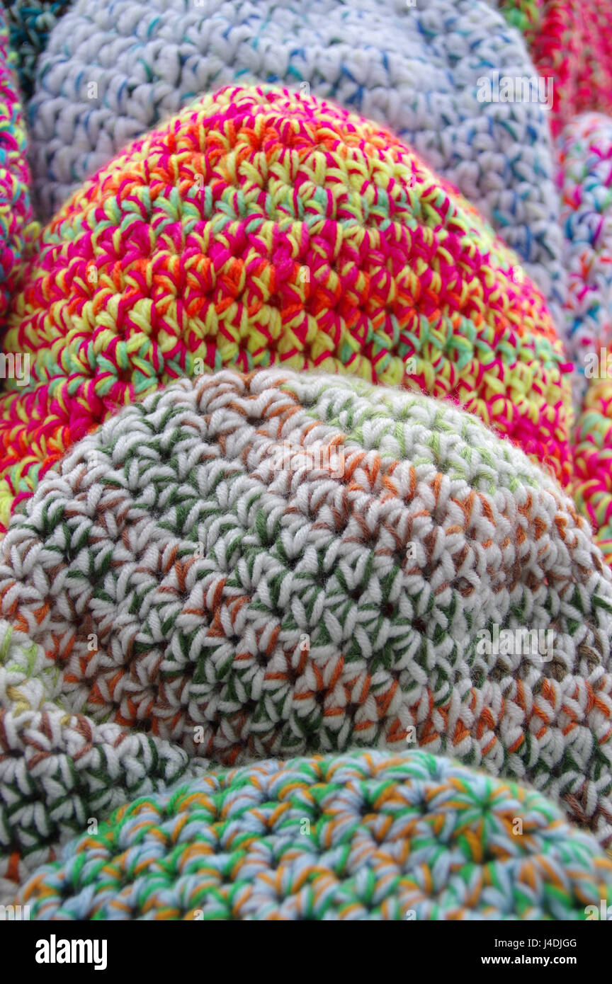 The handmade wool caps in variegated colors Stock Photo - Alamy