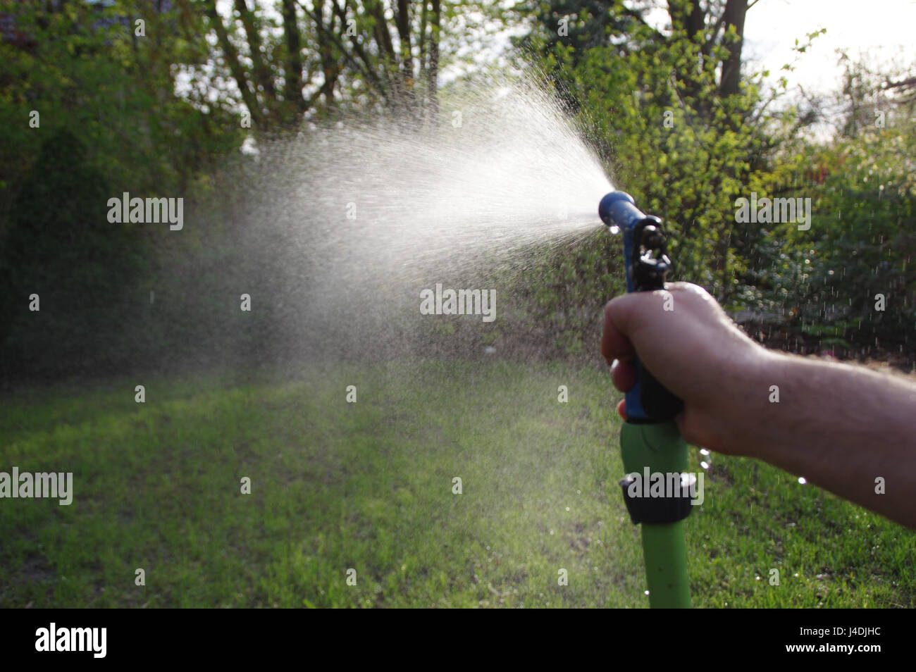 Hand holding water gun hi-res stock photography and images - Alamy