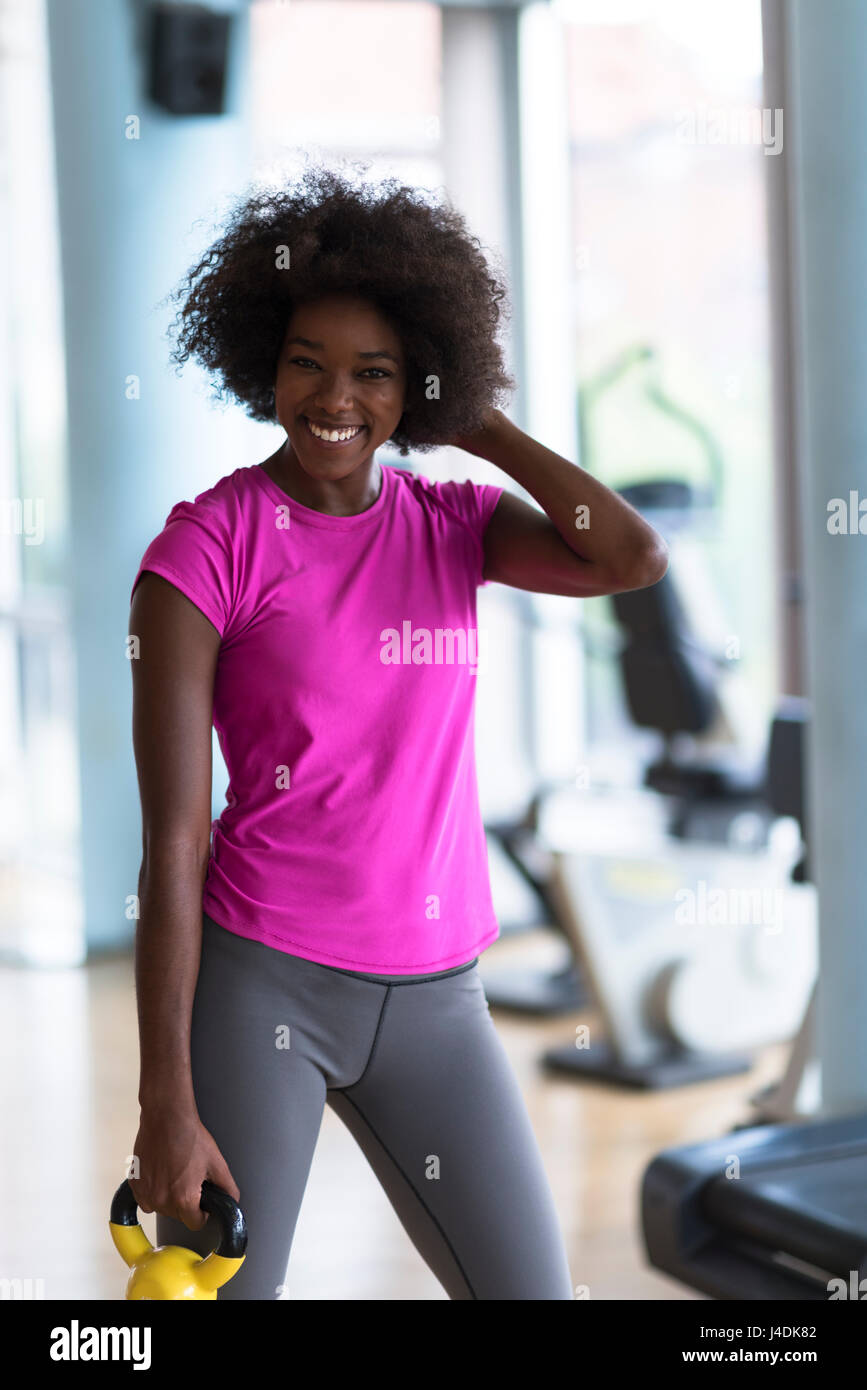 happy healthy african american woman working out in a crossfit gym on ...