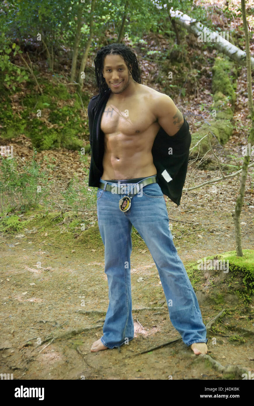 Very fit man in a forest location - fashion Stock Photo - Alamy