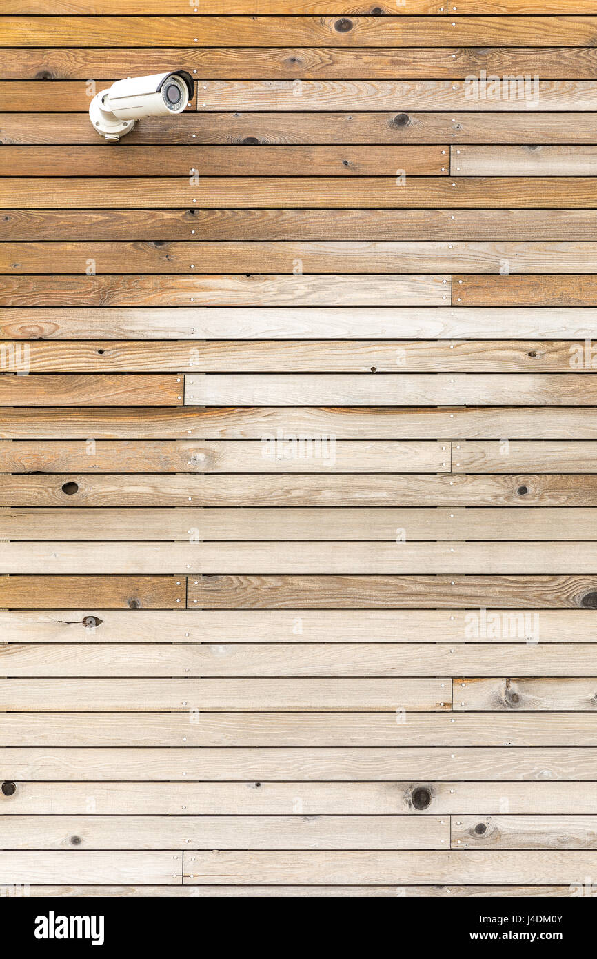 Security Camera CCTV on wooden panel wall Stock Photo - Alamy