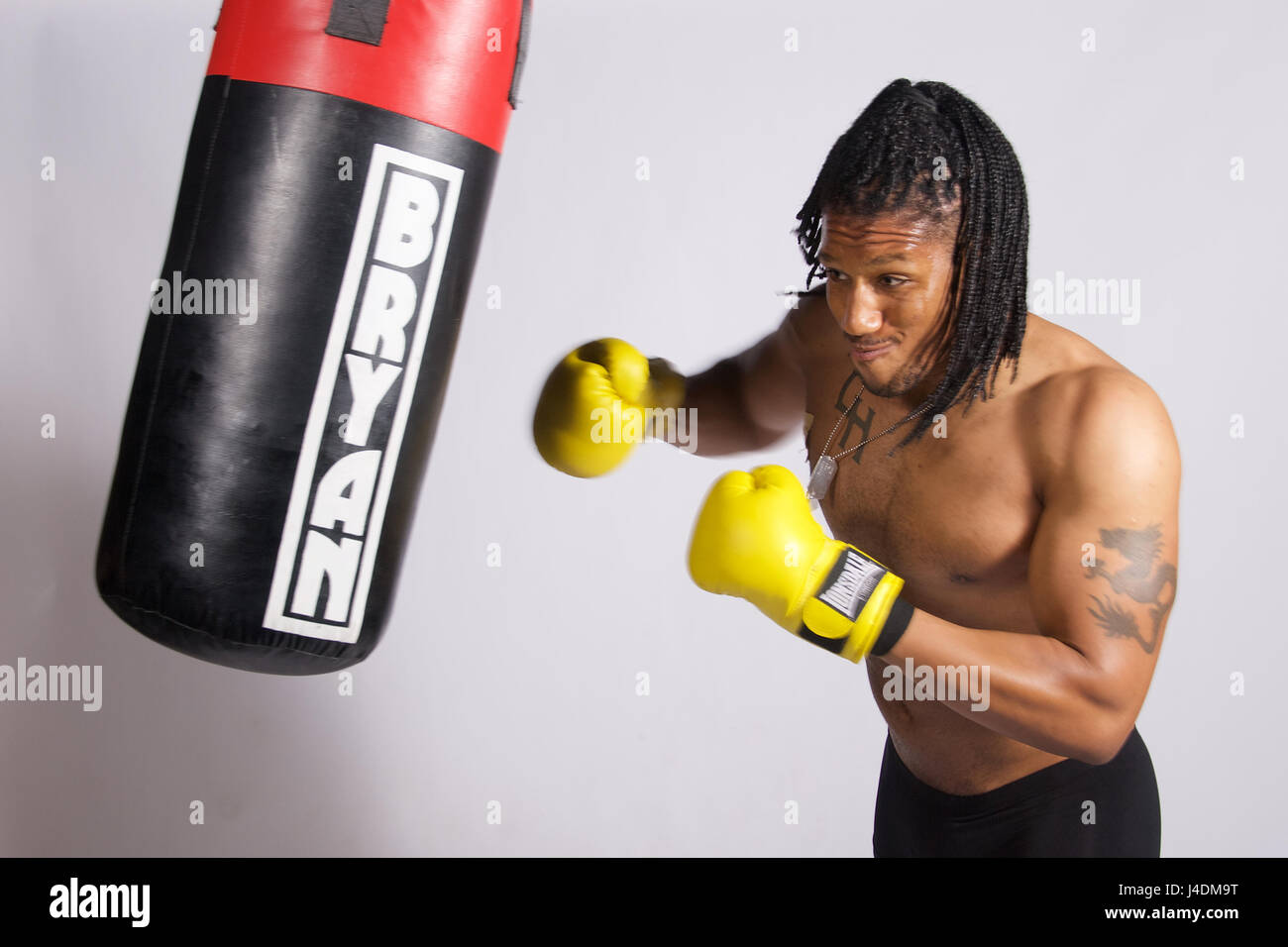 Strong fit black man boxing in a studio with white background Stock ...