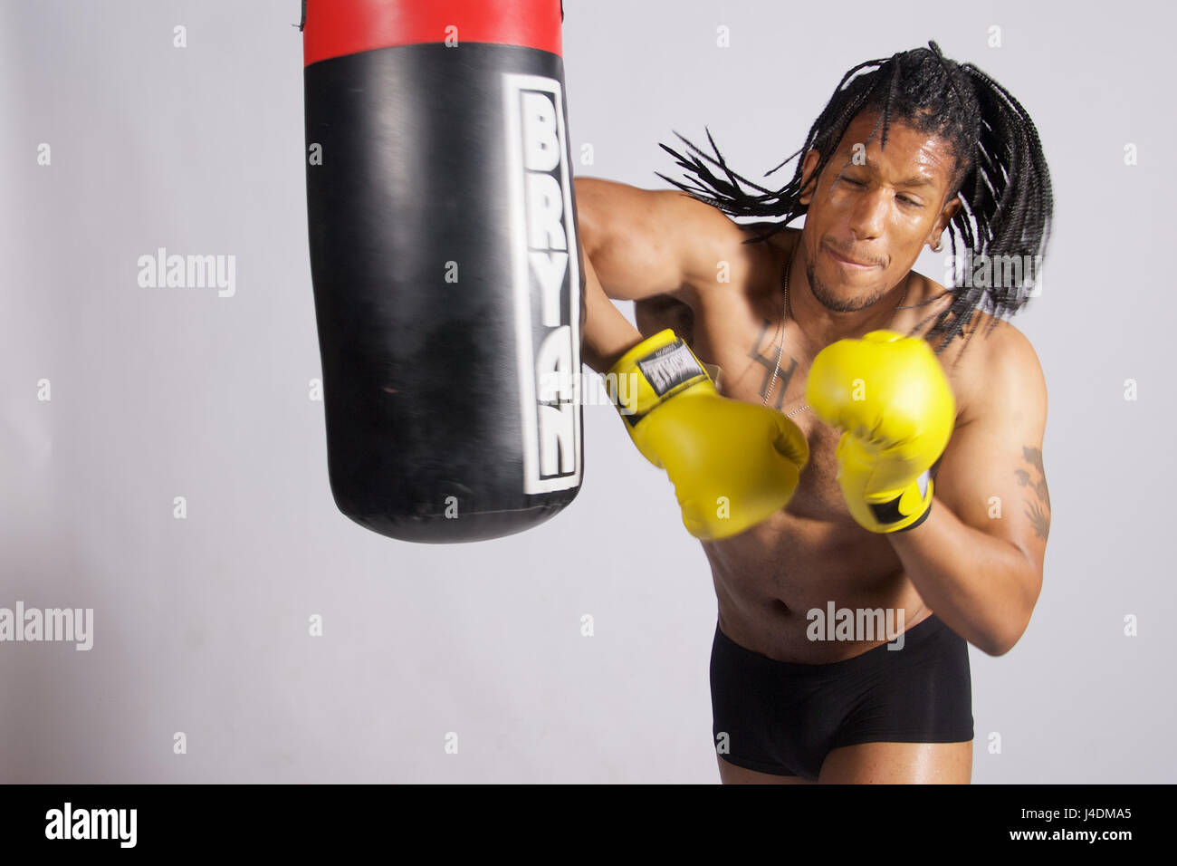 Strong fit black man boxing in a studio with white background Stock ...