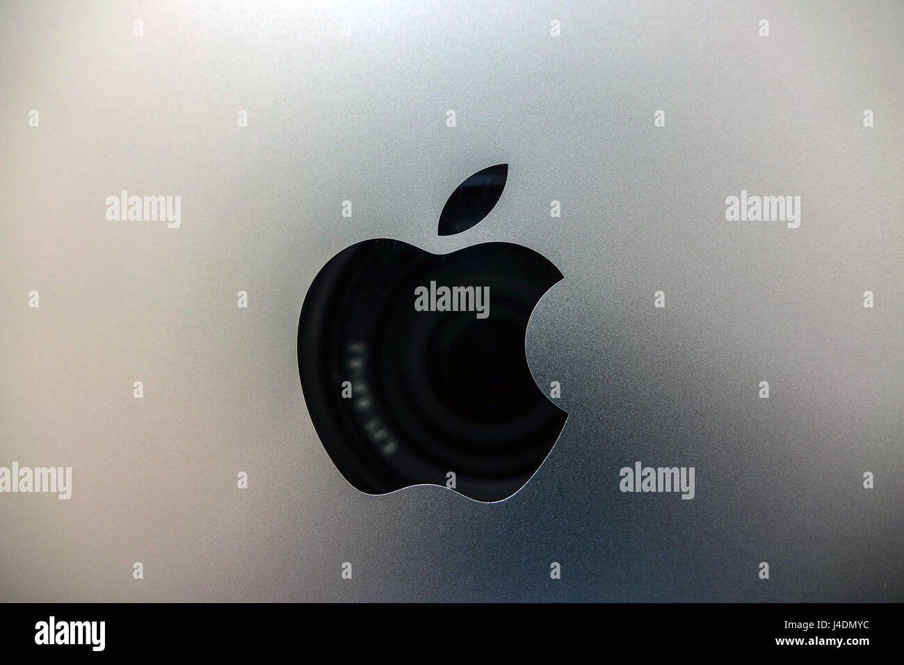 Shiny Apple logo on front of new Apple MacBook Pro laptop computer ...