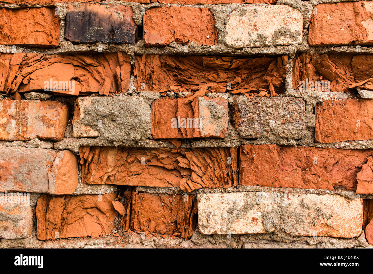 Fragment of weathered red brick wall texture or background Stock Photo - Alamy