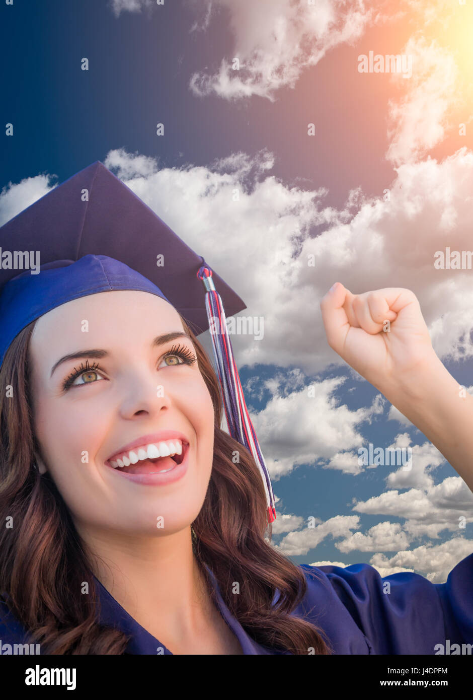Happy Graduating Mixed Race Woman In Cap and Gown Stock Photo - Alamy