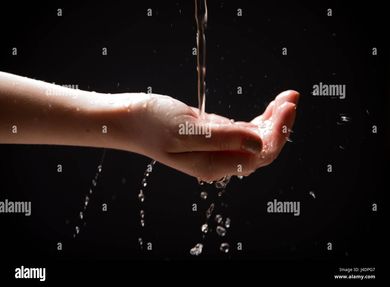 Water hand stream hi-res stock photography and images - Alamy