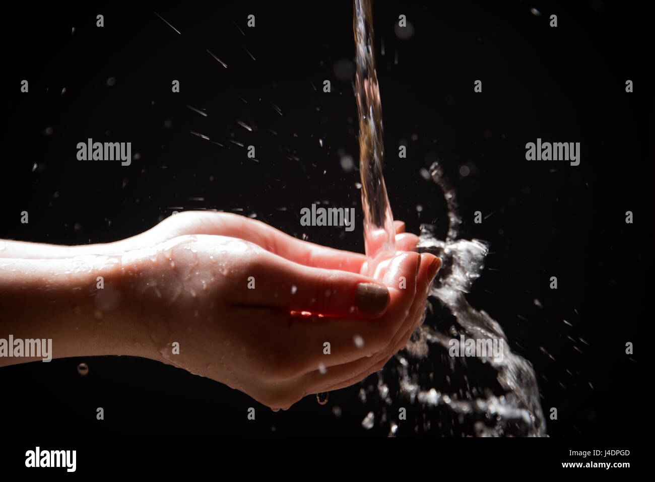 Clean water pouring splashing hands hi-res stock photography and images ...