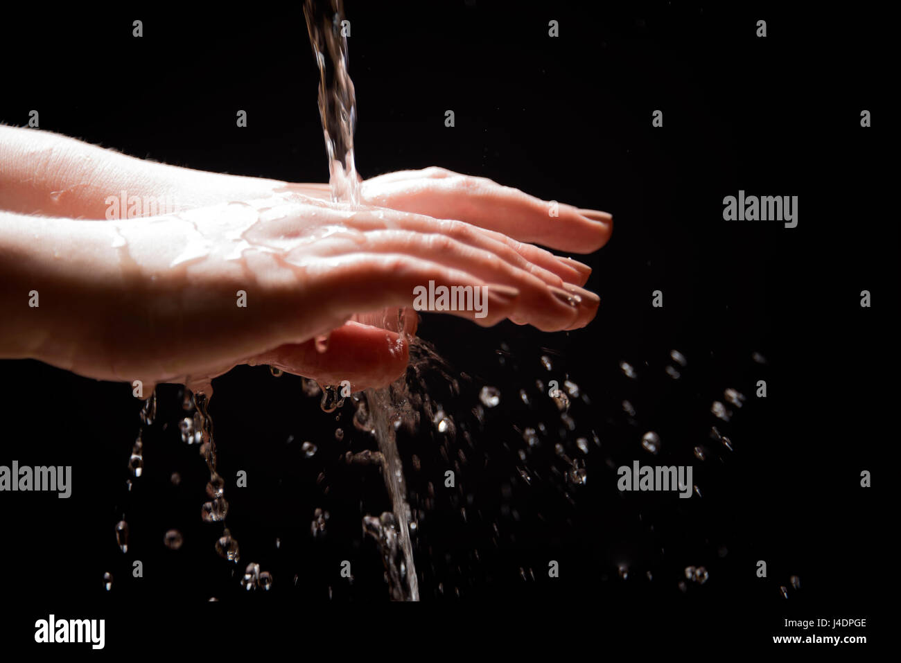 Water falls on the hands Stock Photo - Alamy