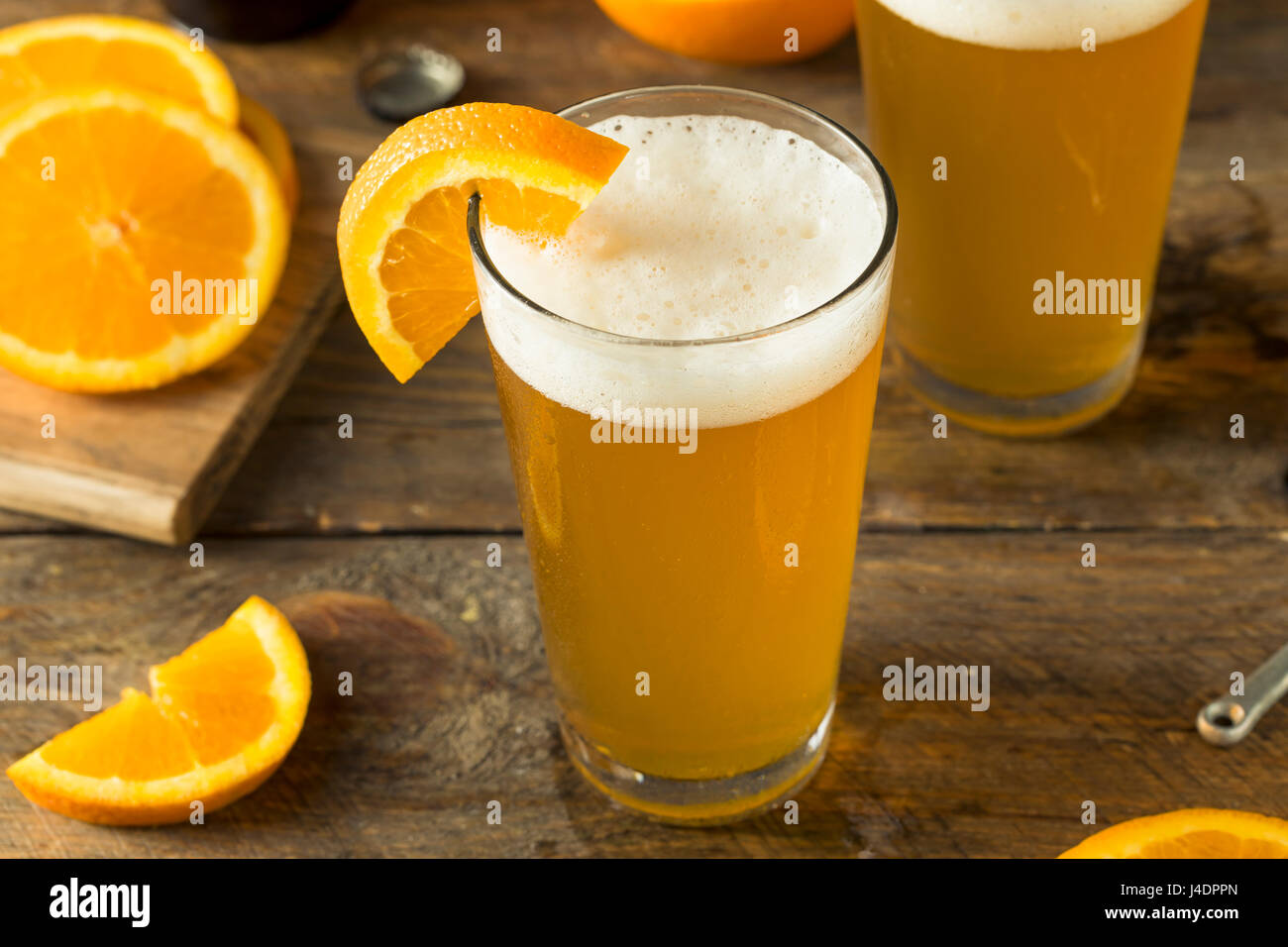 Organic Orange Citrus Craft Beer with a Garnish Stock Photo - Alamy