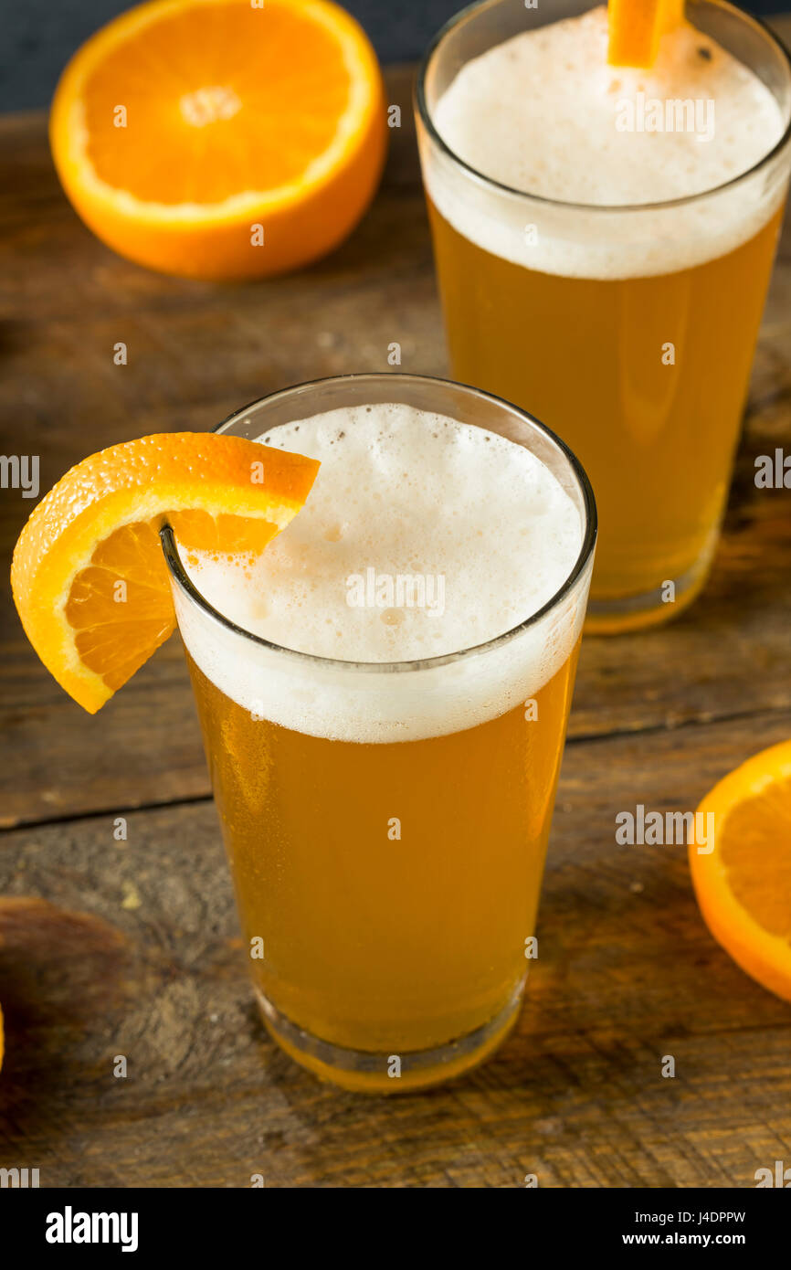 Organic Orange Citrus Craft Beer with a Garnish Stock Photo - Alamy