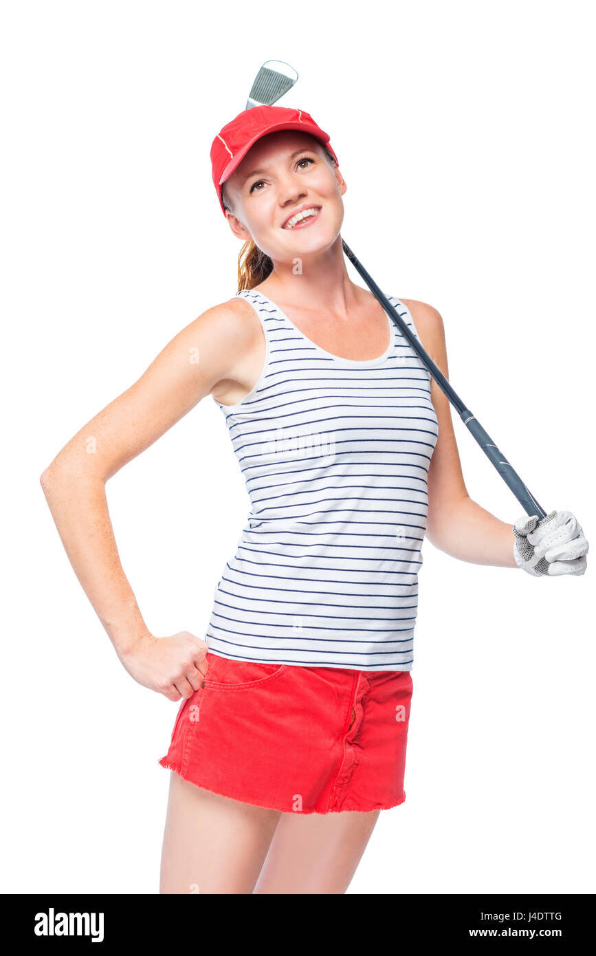 Cheerful girl with a golf club in a red cap and skirt on a white ...