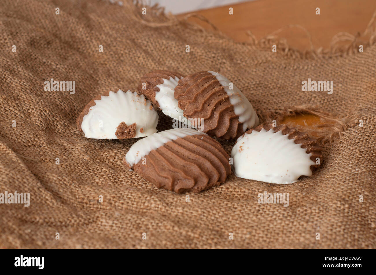 Shell shaped cookies isolated on the sackcloth texture background Stock ...