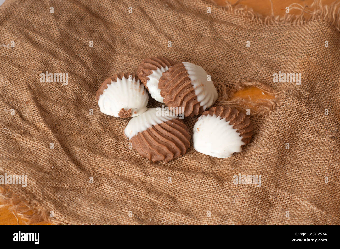 Shell shaped cookies isolated on the sackcloth texture background Stock ...