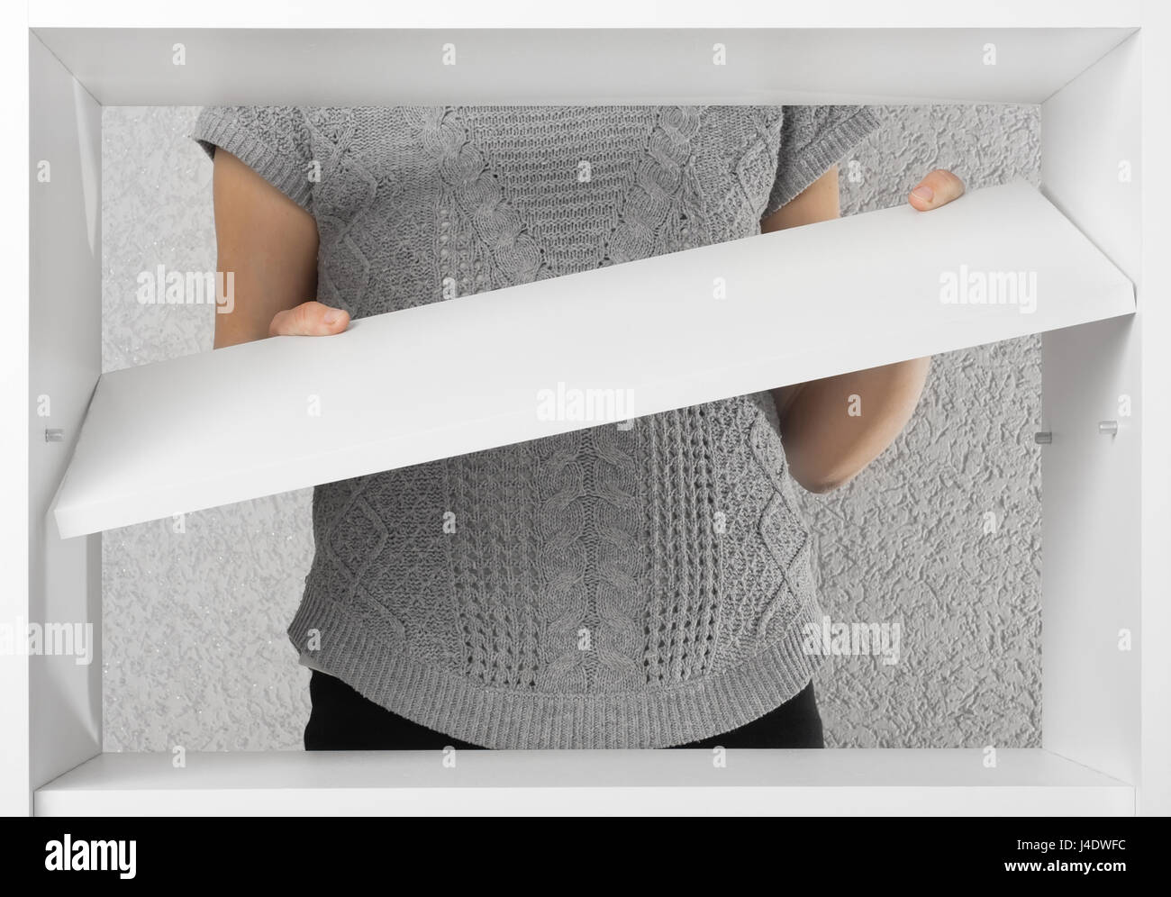 hands assembling shelf inside kitchen cabinet Stock Photo - Alamy