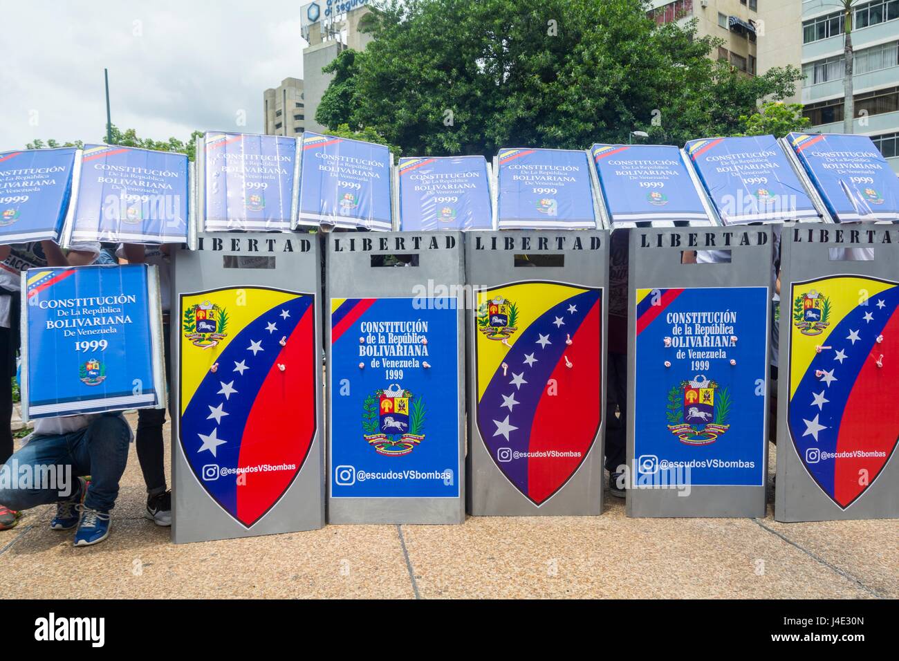 Metal shields, with labels of the 1999 Constitution of Venezuela. Under ...