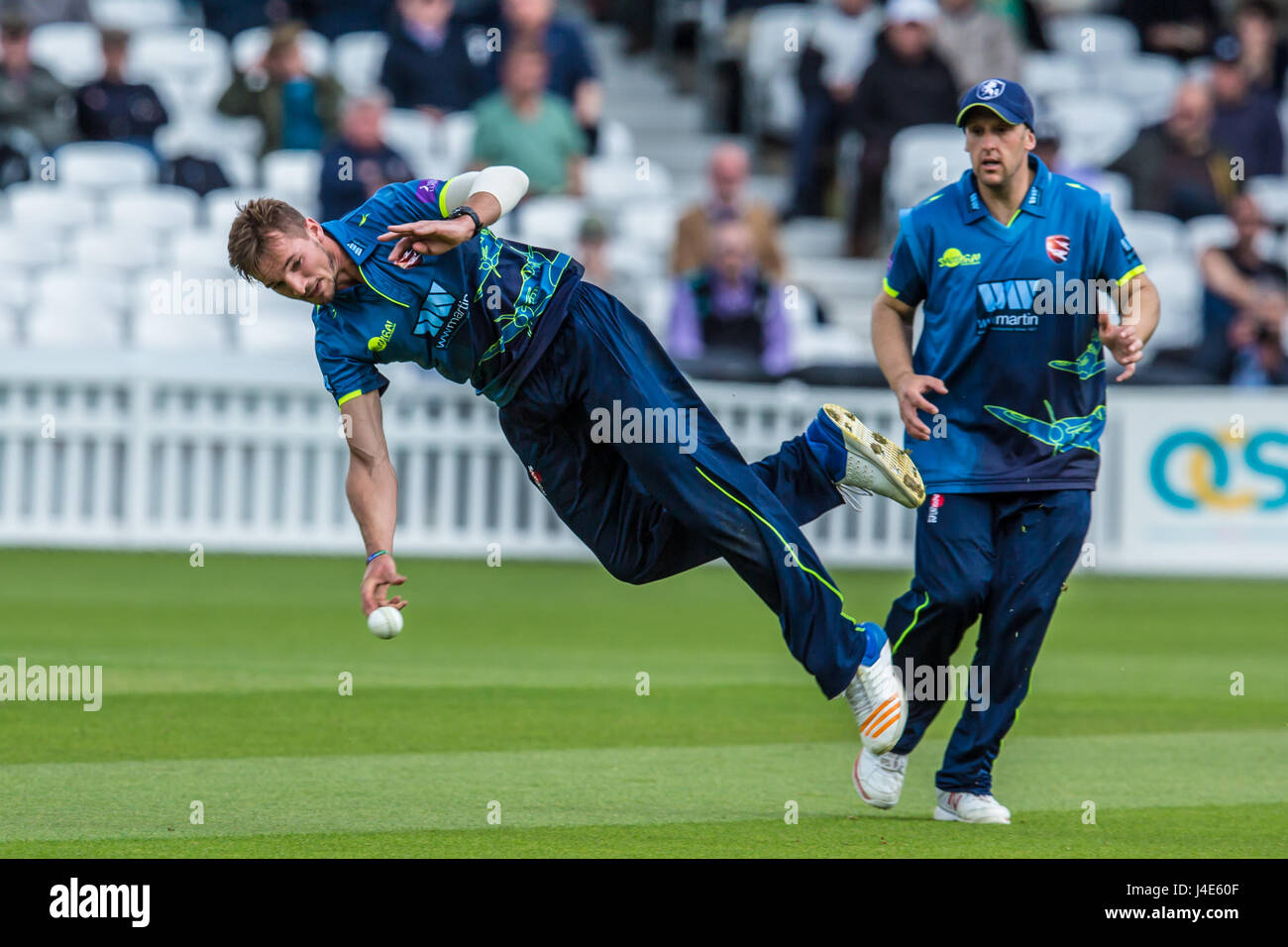 London, UK. 12th May, 2017. Charlie Hartley fielding off his own ...
