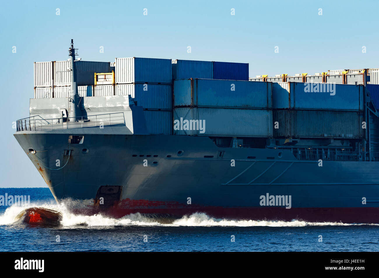 Large grey container ship moving from Baltic sea Stock Photo - Alamy