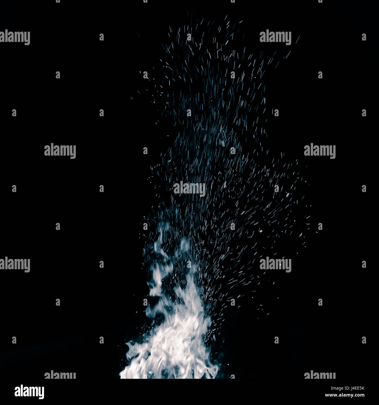 Blue bonfire with flying sparks isolated on black Stock Photo - Alamy