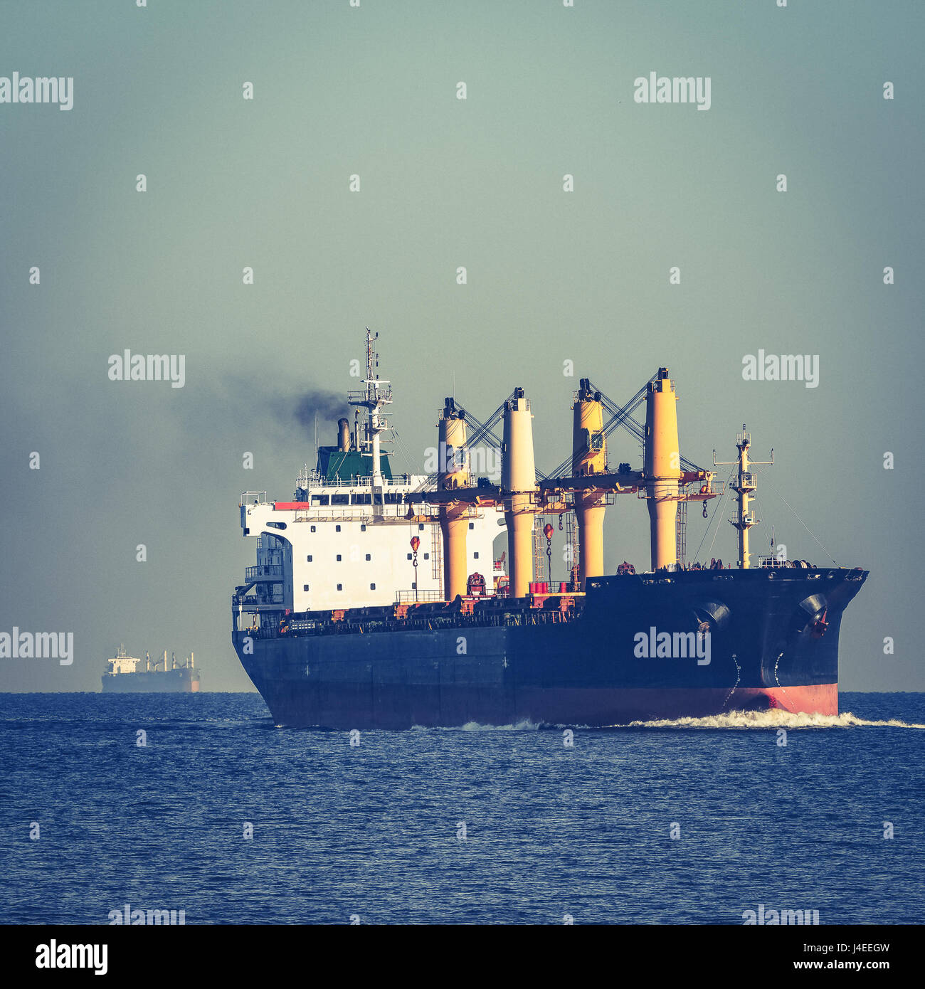 Black cargo ship sailing from the Baltic sea Stock Photo - Alamy
