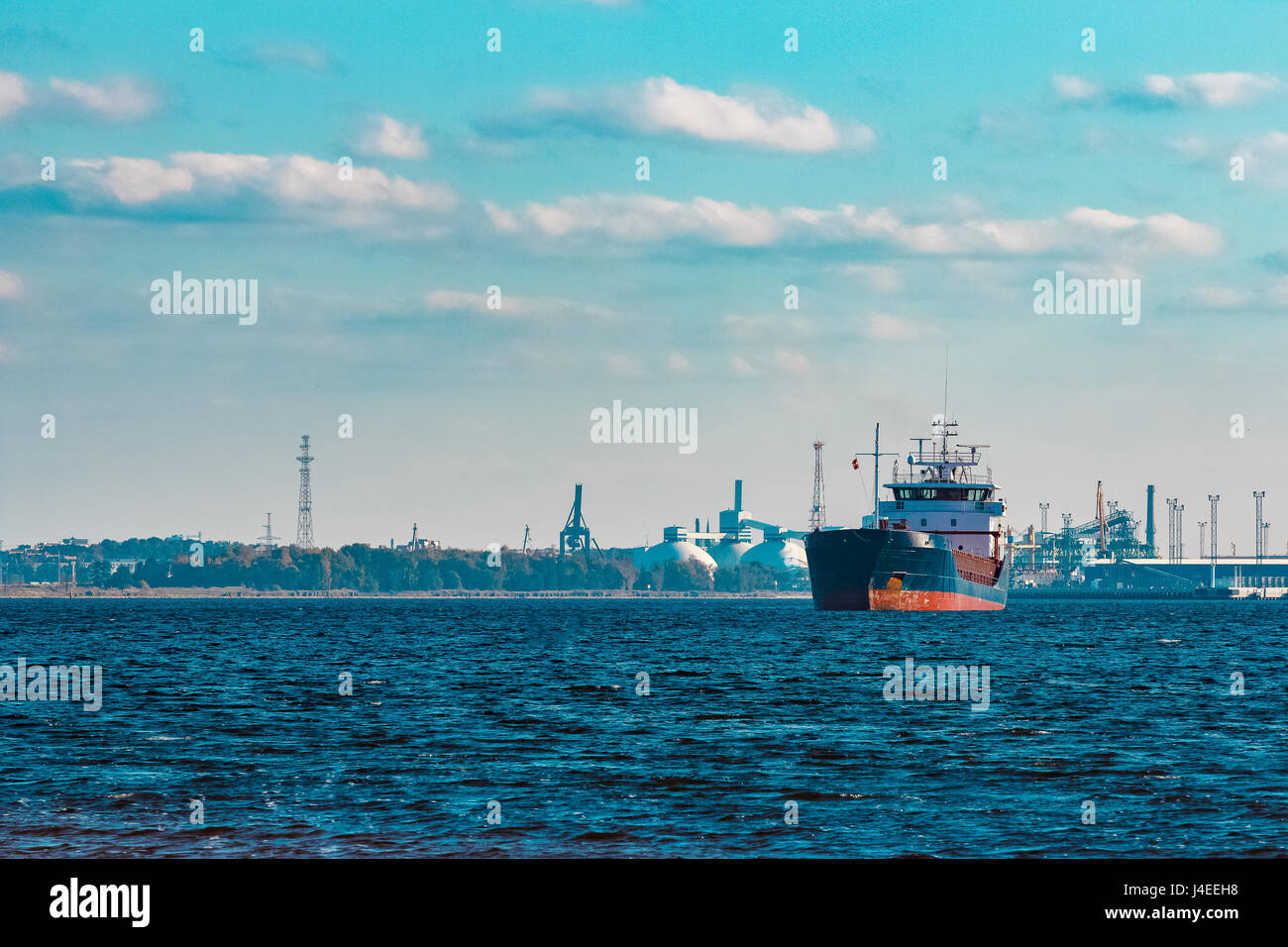 Blue cargo ship moving to the cargo port Stock Photo - Alamy