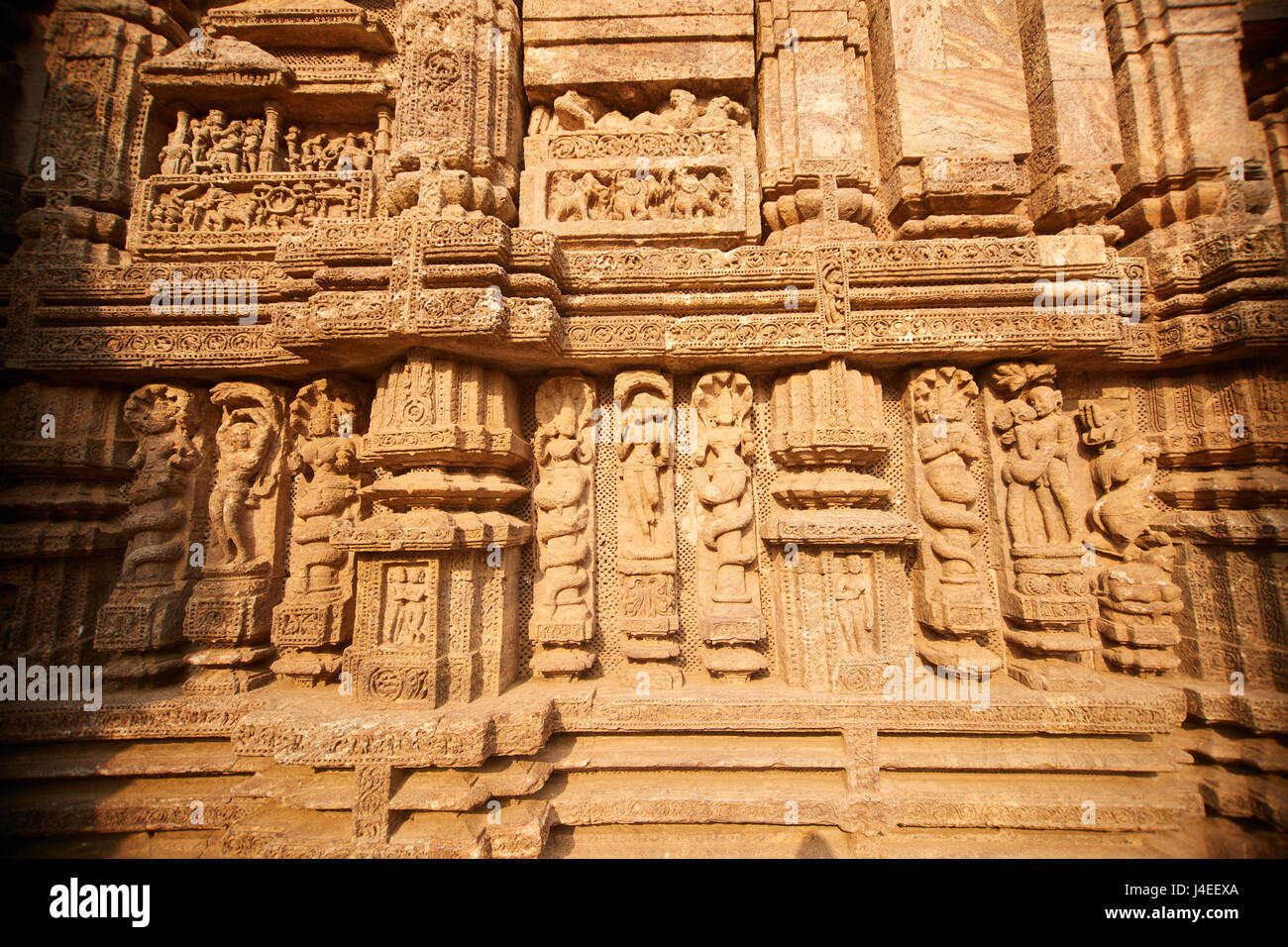 Ancient sandstone carvings on the walls of the ancient sun temple at ...