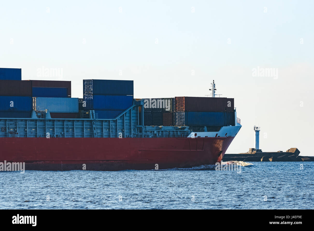 Red container ship sailing to the Baltic sea Stock Photo - Alamy