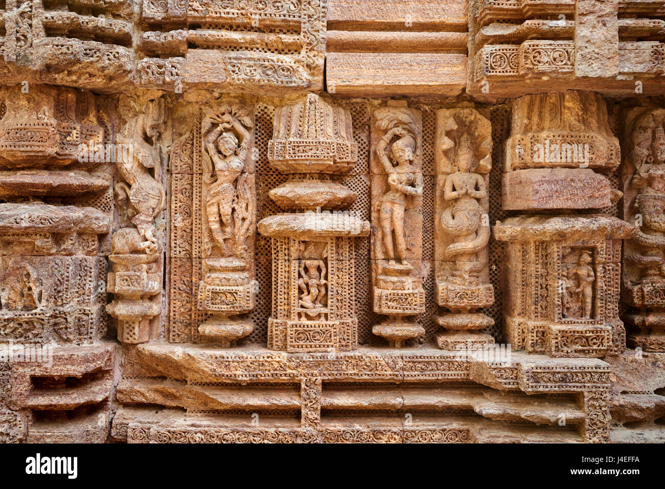 Ancient sandstone carvings on the walls of the ancient sun temple at ...