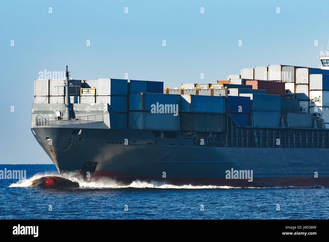 Large grey container ship moving from Baltic sea Stock Photo - Alamy