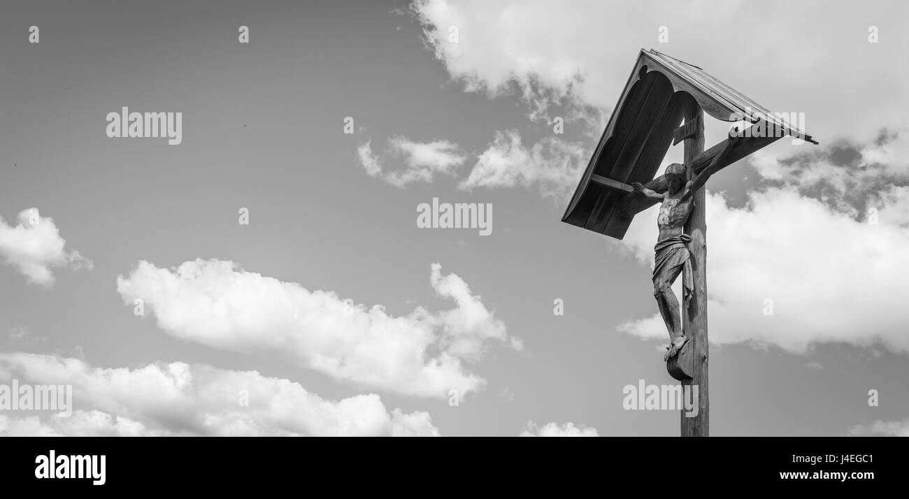 A 100 years old Crucifix, made of wood, tipical of Dolomity Region in ...