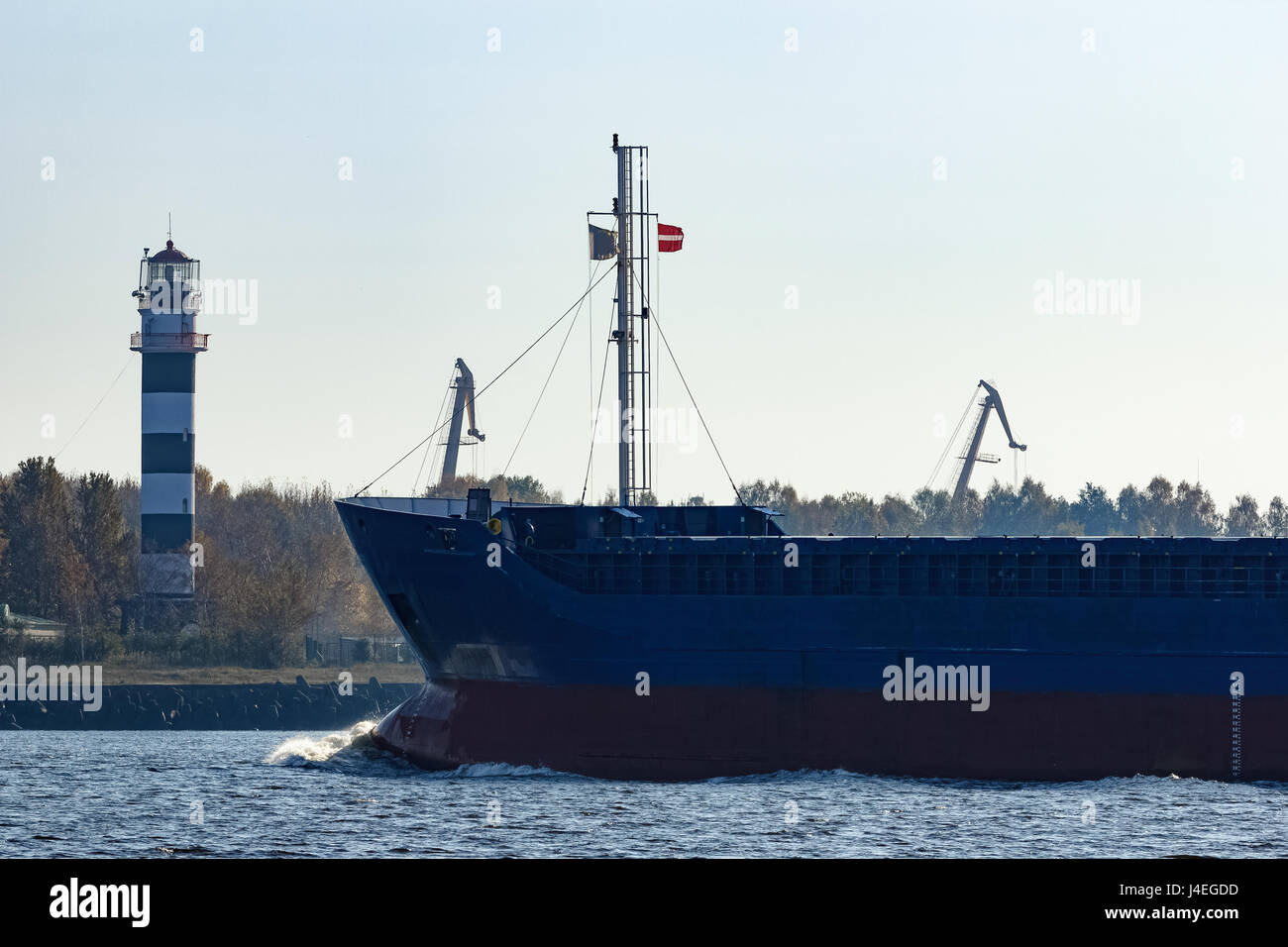 Blue cargo ship sailing from the Baltic sea Stock Photo - Alamy