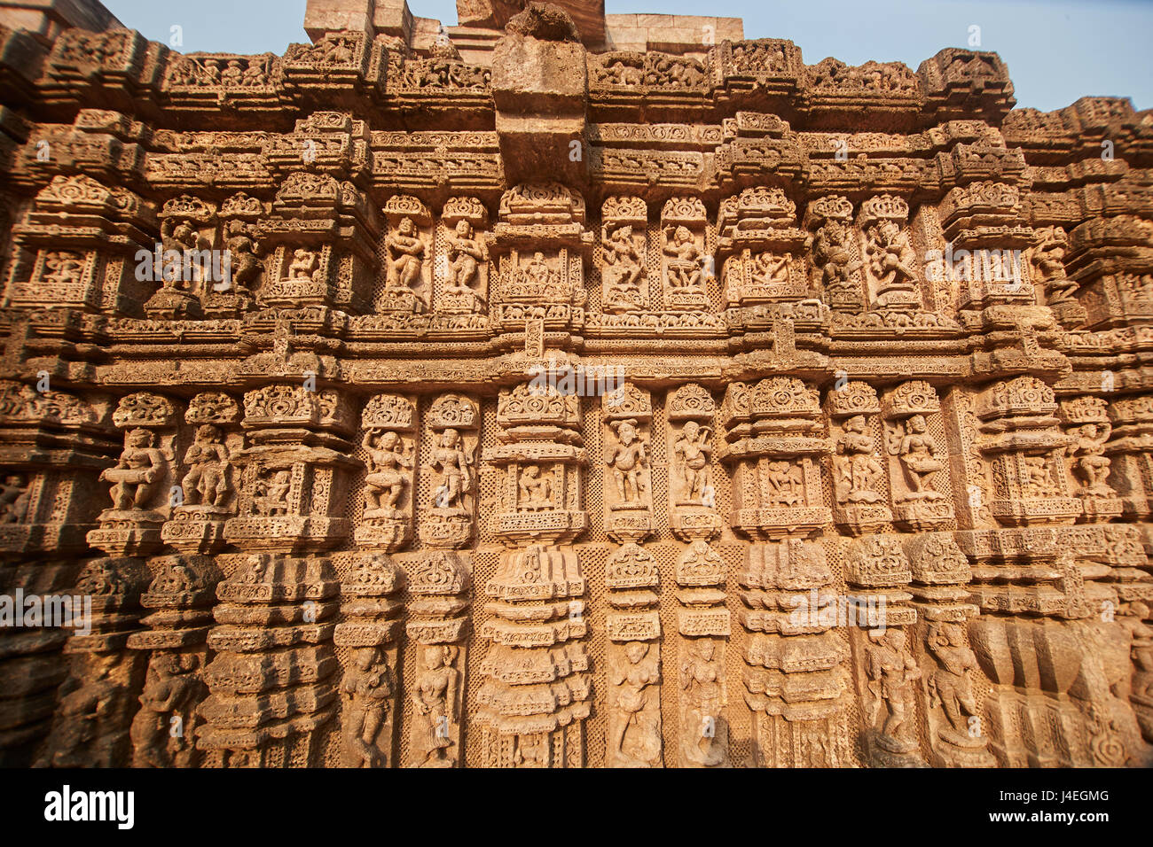 Ancient sandstone carvings on the walls of the ancient sun temple at ...