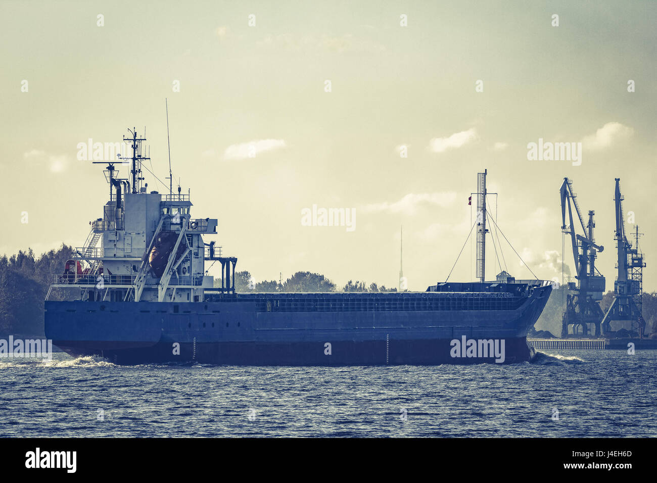 Blue cargo ship sailing from the Baltic sea Stock Photo - Alamy
