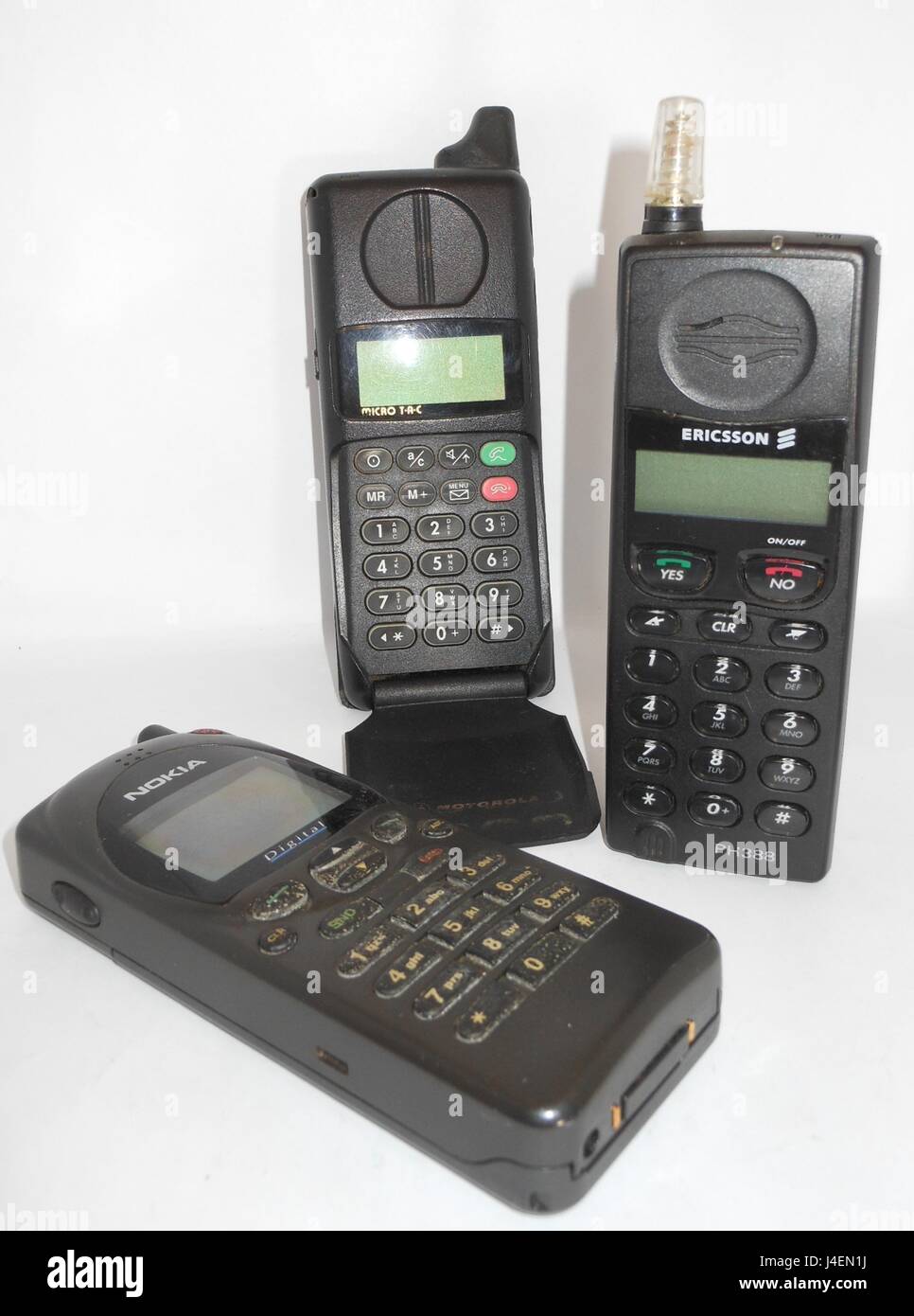 3 old style mobile phones with white background Stock Photo - Alamy