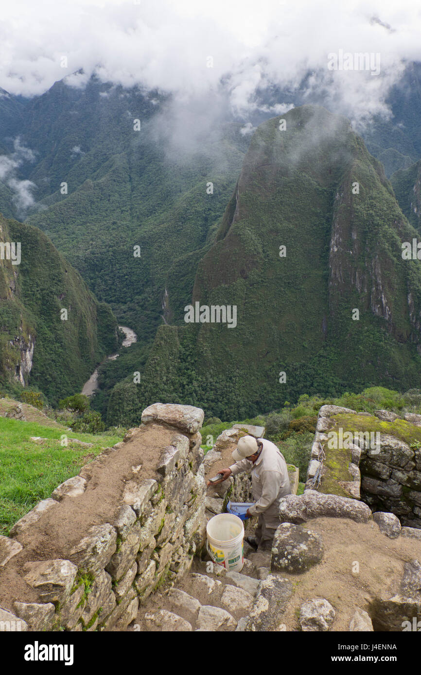 Restoration work at the Inca ruins of Machu Picchu, UNESCO World ...