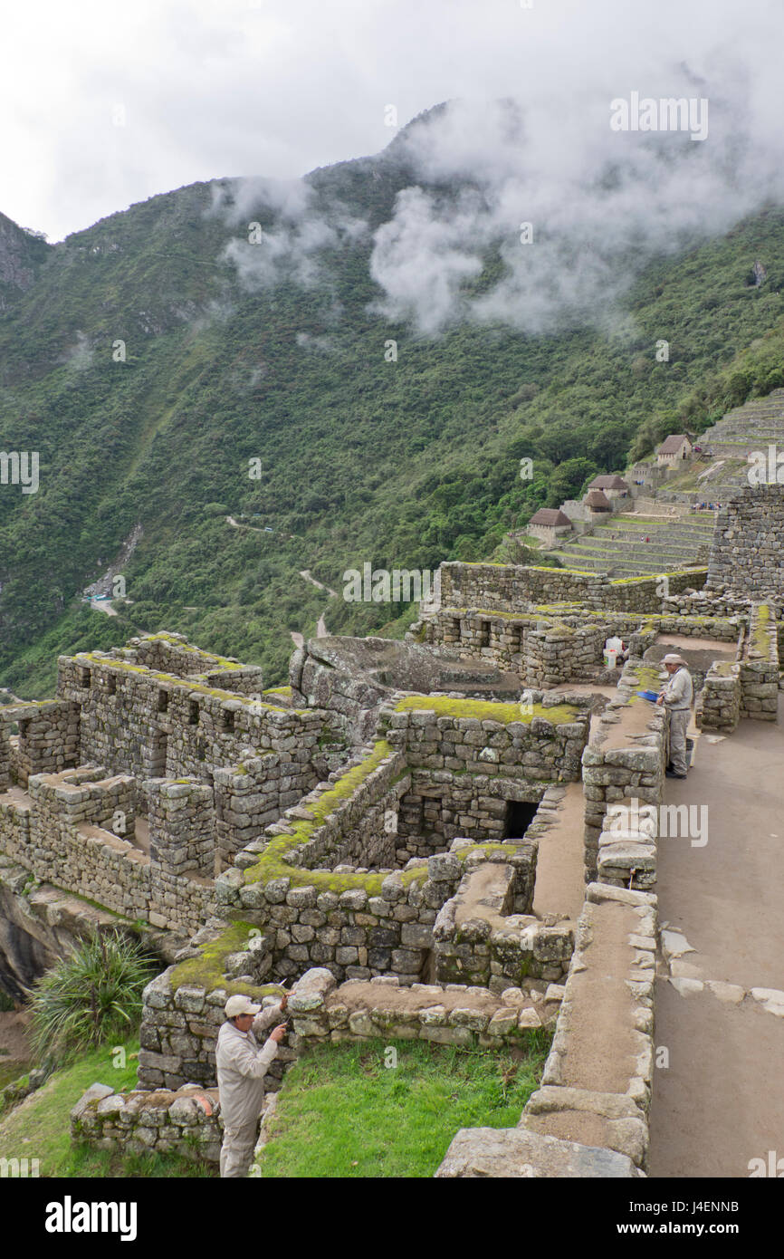 Restoration work at the Inca ruins of Machu Picchu, UNESCO World ...