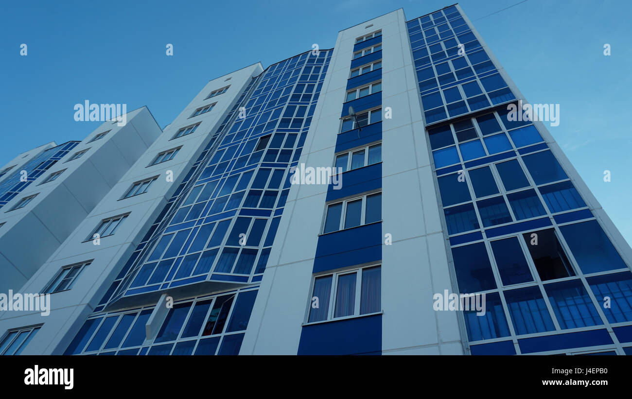 blue and white high-rise building,view from below Stock Photo - Alamy