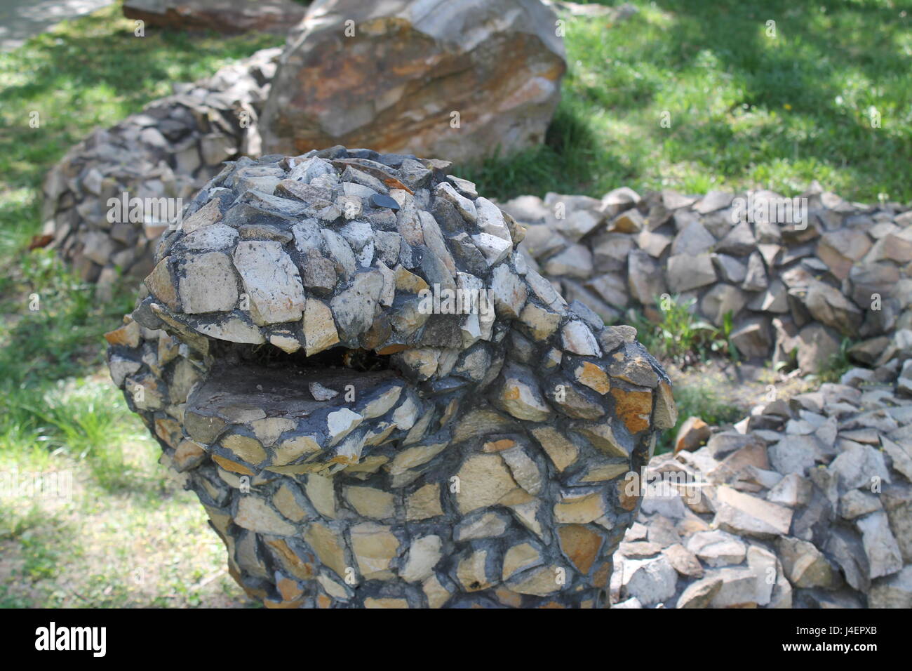 stone sculpture of a snake in the Park Stock Photo - Alamy