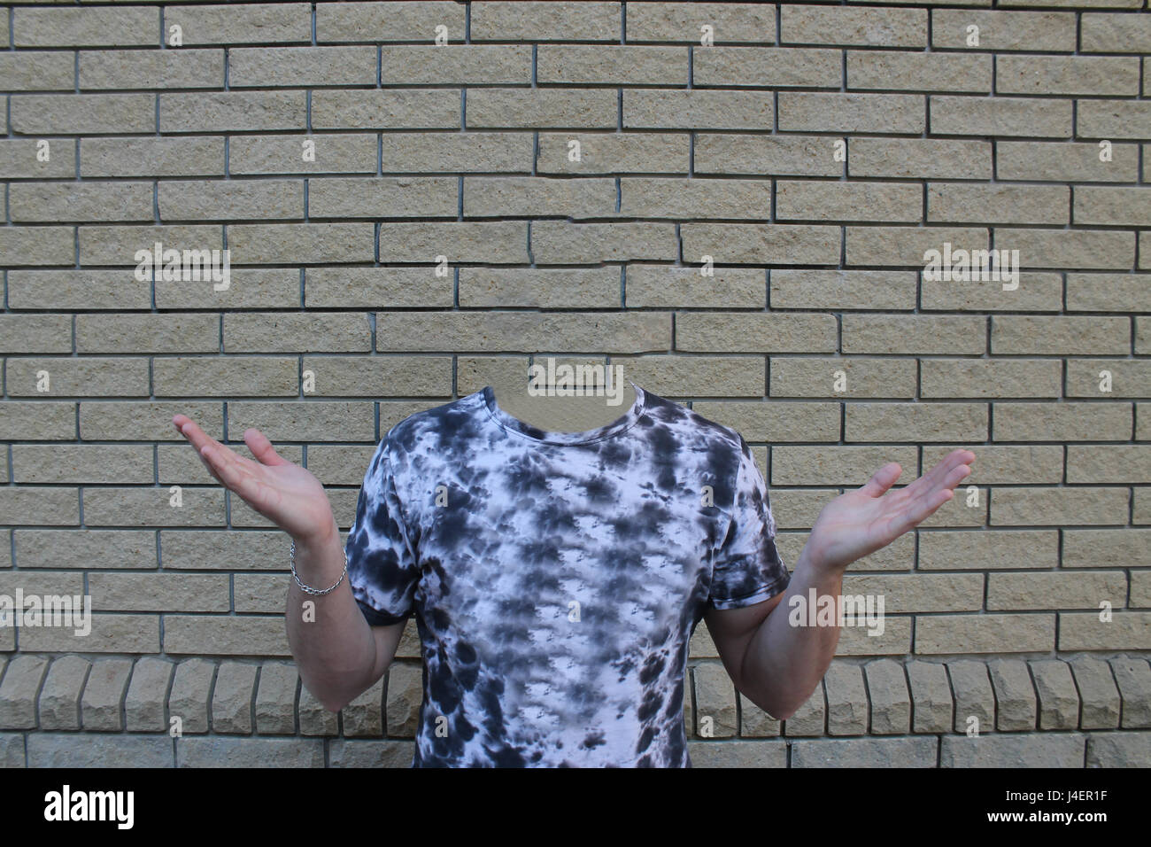 a young man without a head against the wall Stock Photo - Alamy