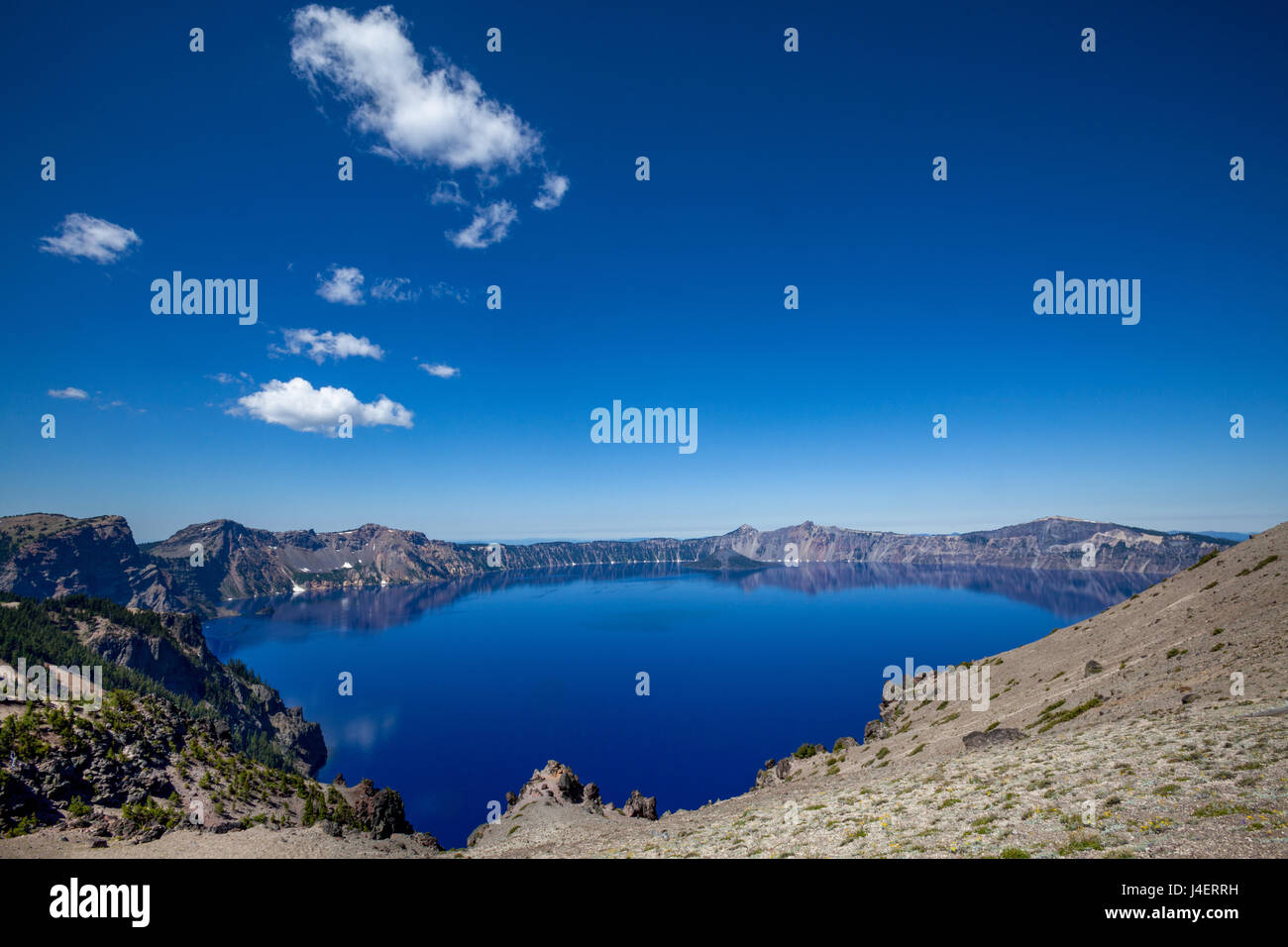 The still waters of Crater Lake, the deepest lake in the U.S.A., part ...