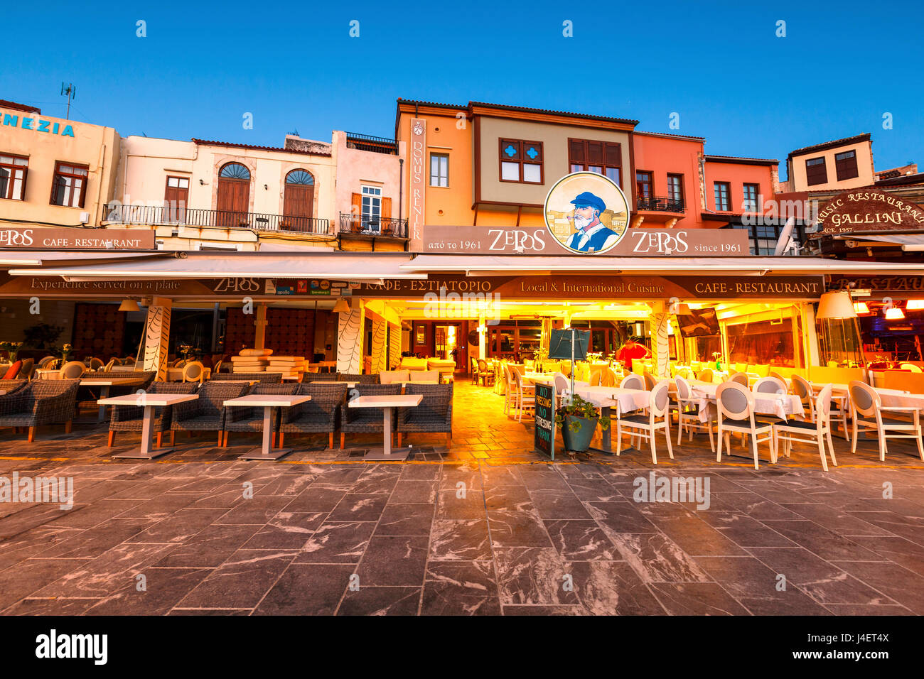 Restaurants in the old Venetian harbor of Chania town on Crete island ...