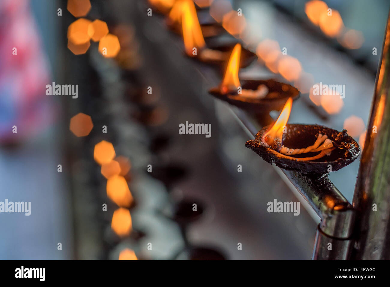 Coconut oil lamps for sacred fire in Buddha Tooth Relic Temple in Kandy ...