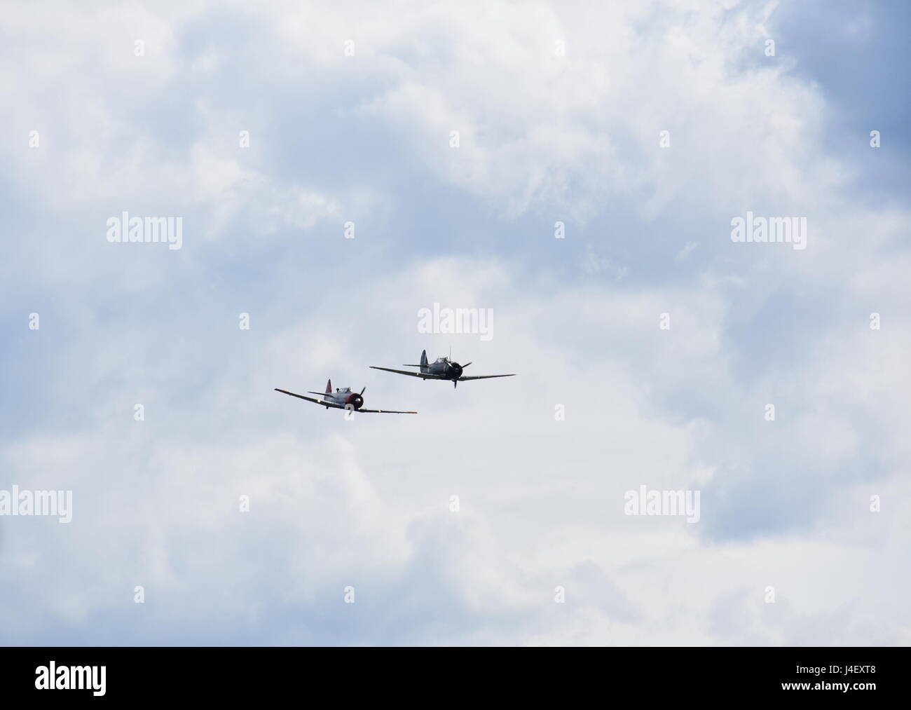 Airplane aerobatics, two airplanes flying together on an airshow Stock ...